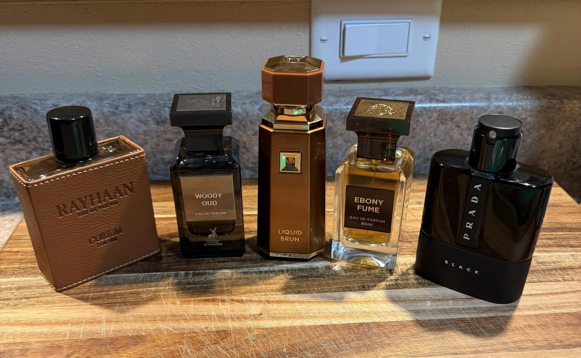 Liquid Brun, Woody Oud, Ebony Fume, Corium, and Prada Black (Bottle)